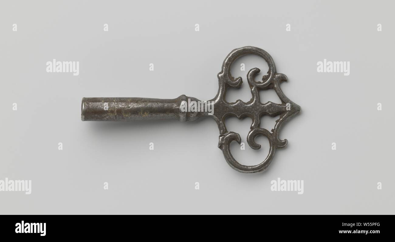 Spanner associated with a clock. The handle consists of two C-volutes ...