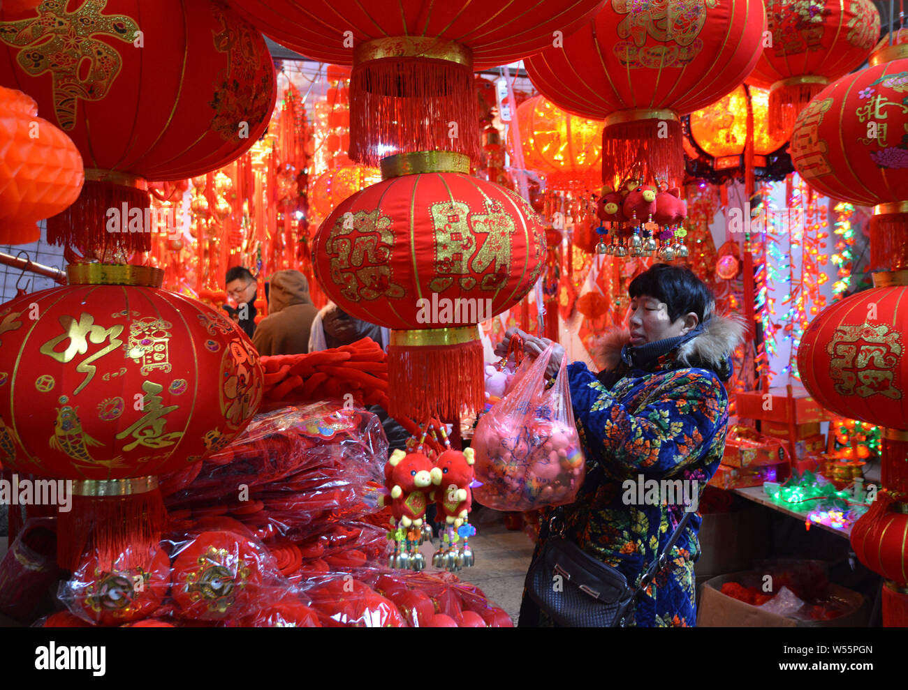 Local Chinese residents shop for red lanterns and decorations for the ...