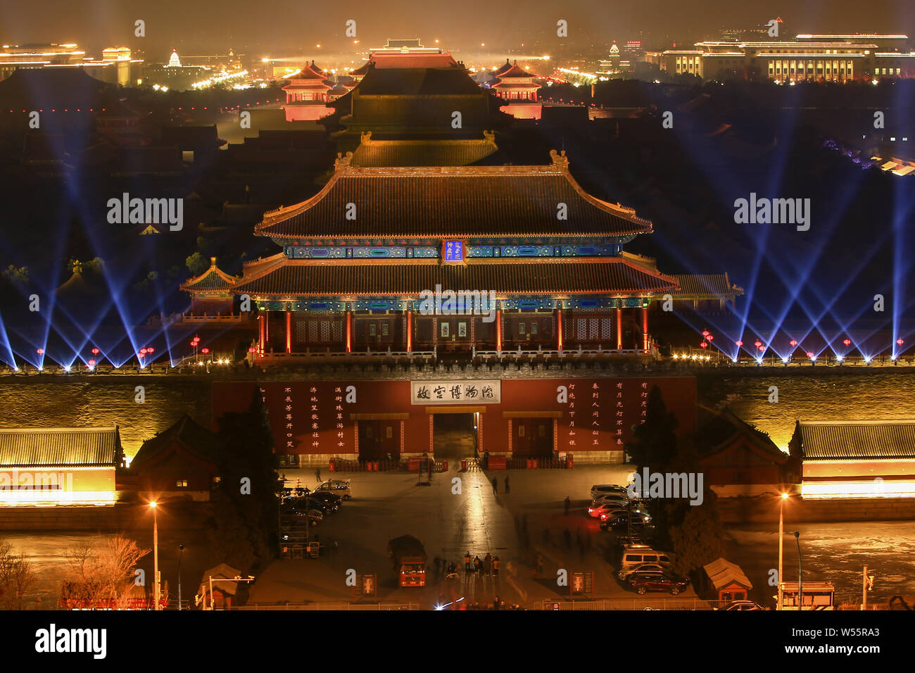 The Palace Museum, also known as the Forbidden City, is illuminated by colorful lights during a ...