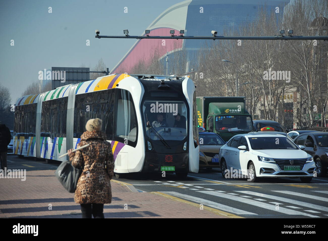 The newly-developed smart electric train runs on a road during its ...