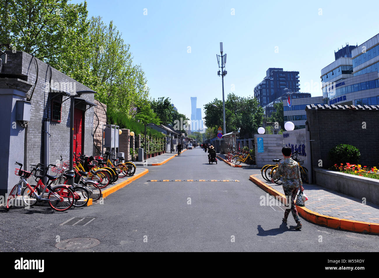 --FILE--People walk past the Henghe Hospital in the Xizongbu Hutong ...