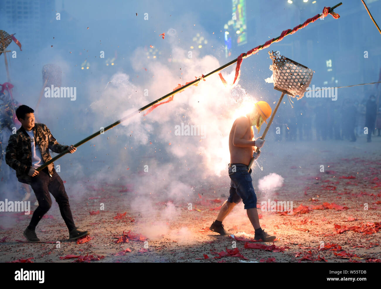 Local Chinese people conduct firecracker dragon performance to ...