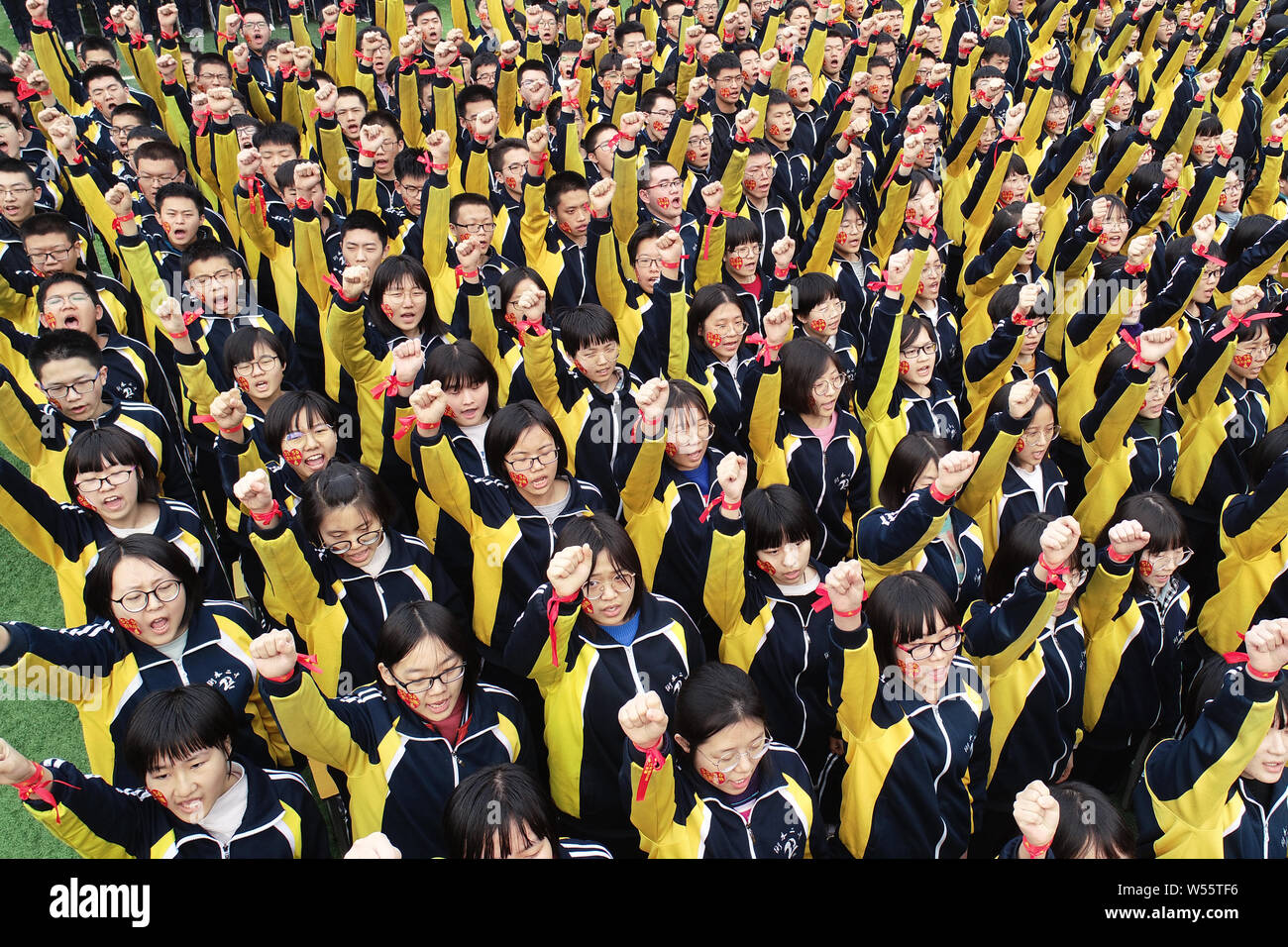 Chinese students queue up in lines during a mass rally for the upcoming ...