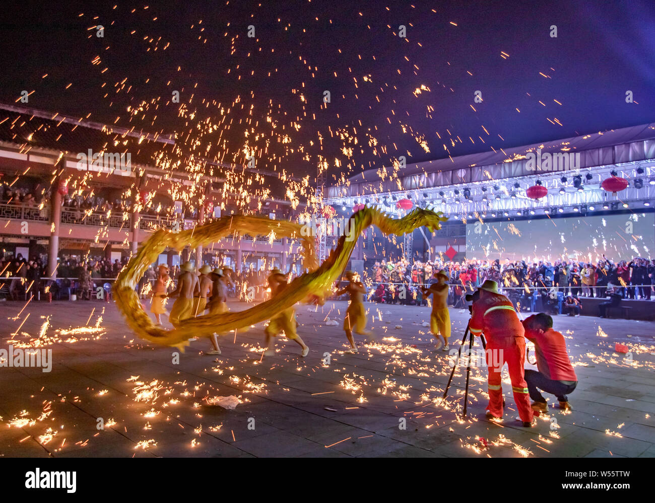 Chinese entertainers perform a fire dragon dance to celebrate the ...