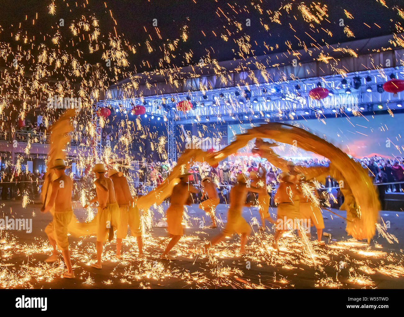 Chinese entertainers perform a fire dragon dance to celebrate the ...