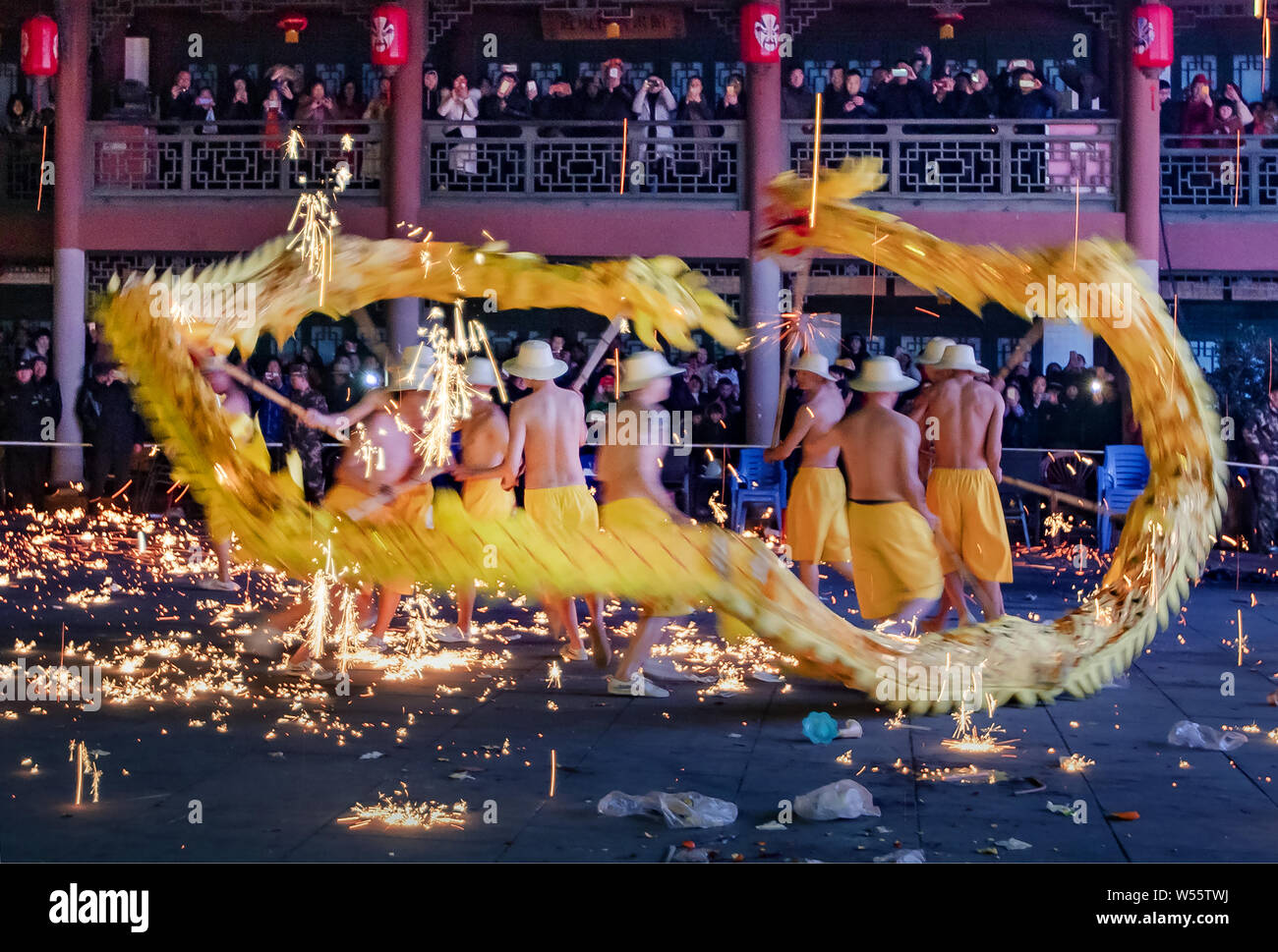 Chinese entertainers perform a fire dragon dance to celebrate the ...