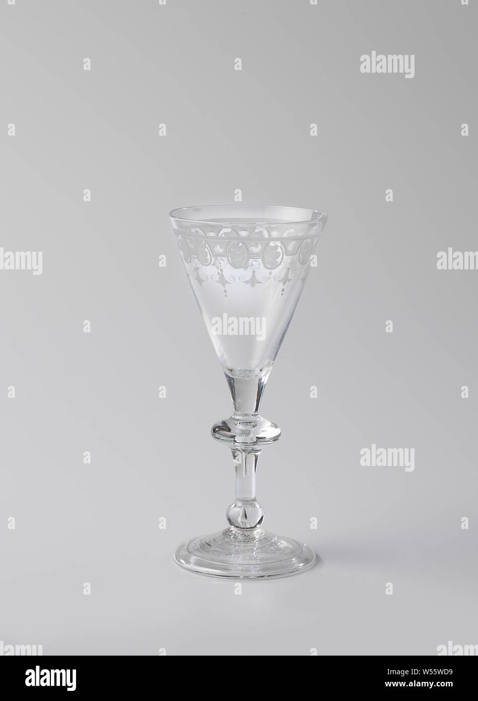 Chalice with an ornament border, arched foot. Baluster stem with two ...