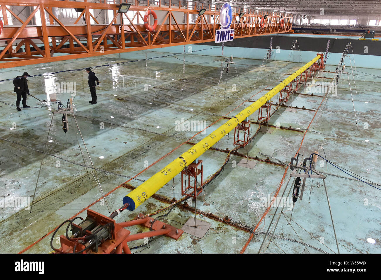Chinese workers labor at the Submerged Floating Tunnel (SFT) Basin for ...