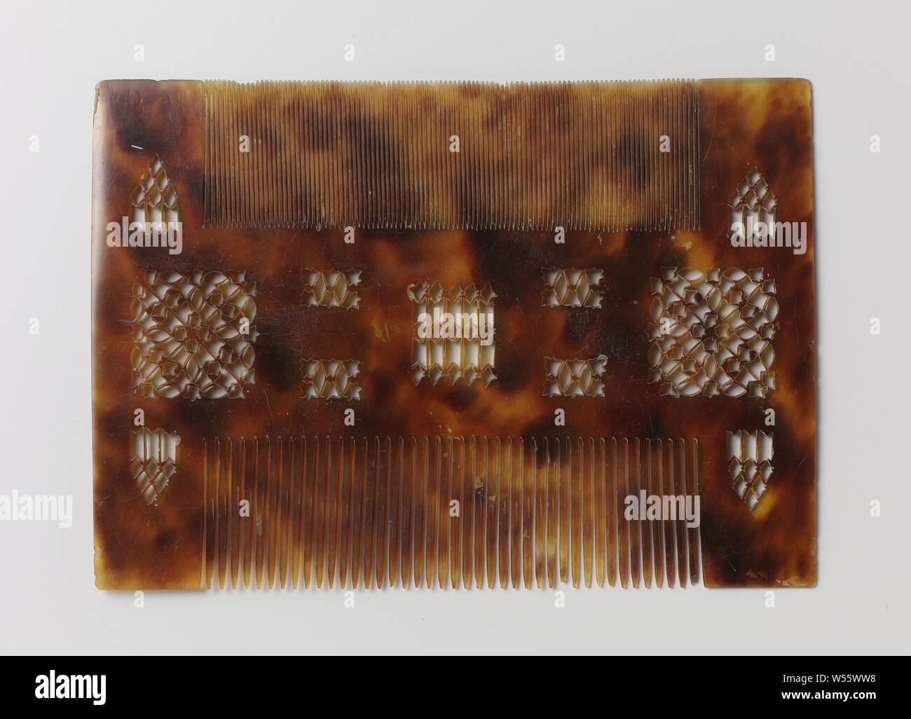 Hair comb of tortoise with ajour cut midfield and teeth on either side ...