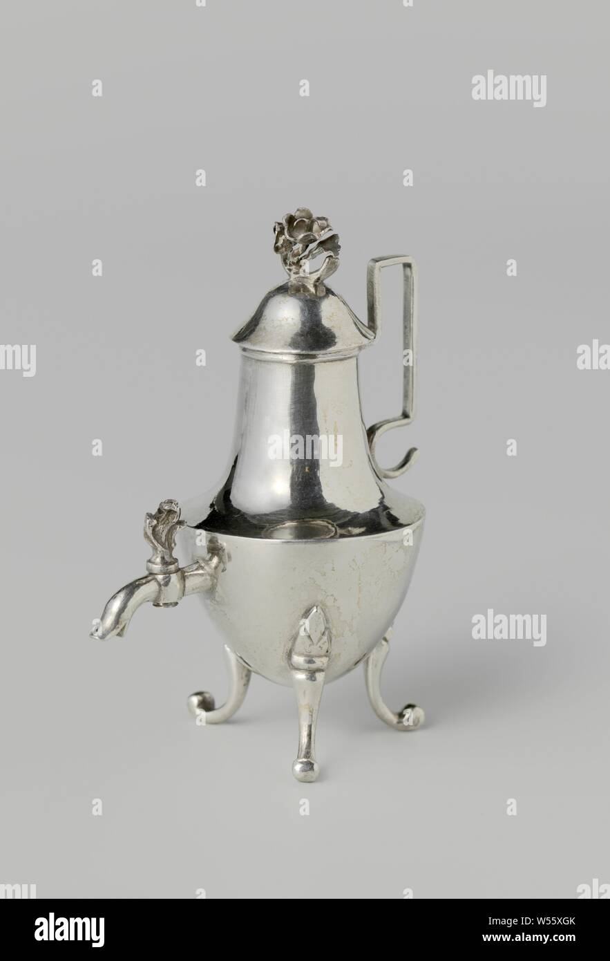 Tap jug, Tap jug on three outward bent legs. The knob of the lid is a ...