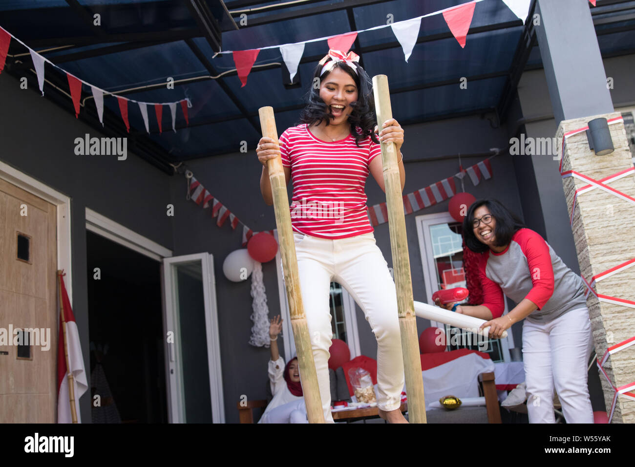 indonesian stilts race competition Stock Photo - Alamy