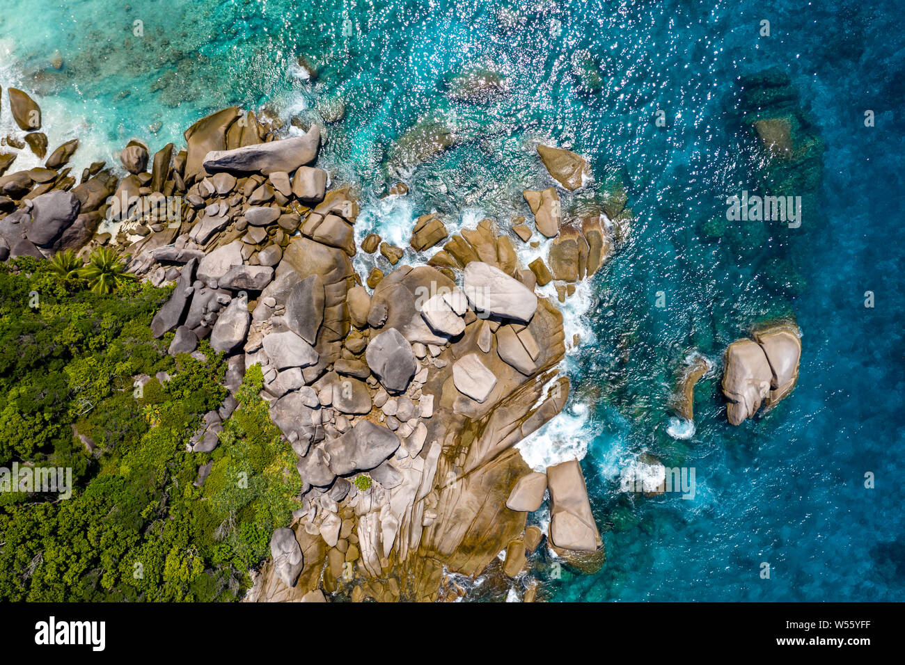 Aerial view of a small bay on a beautiful tropical island with coral ...