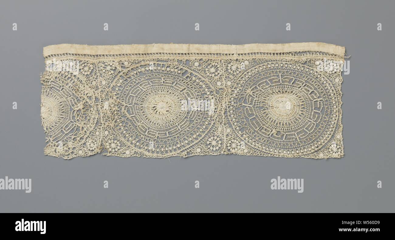 Strip of needle lace with suns around which a decorative frame with ...