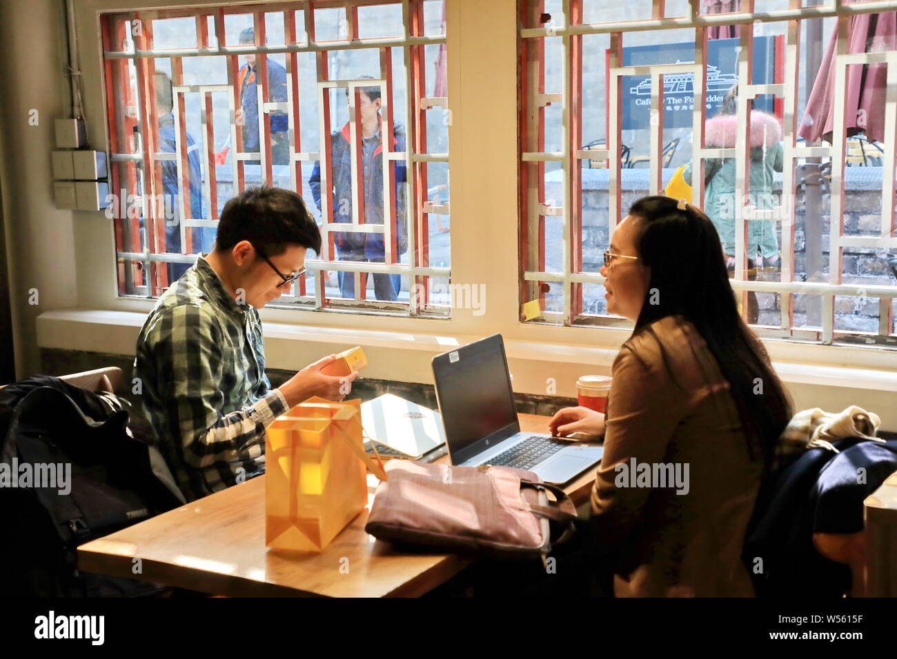 Chinese customers enjoy coffee at the Corner Tower Cafe near the Palace ...