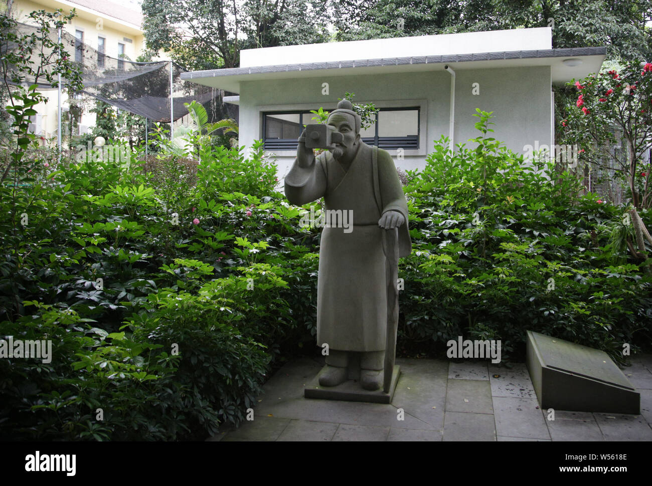 A sculpture of an elderly man dressed in costumes of ancient times ...