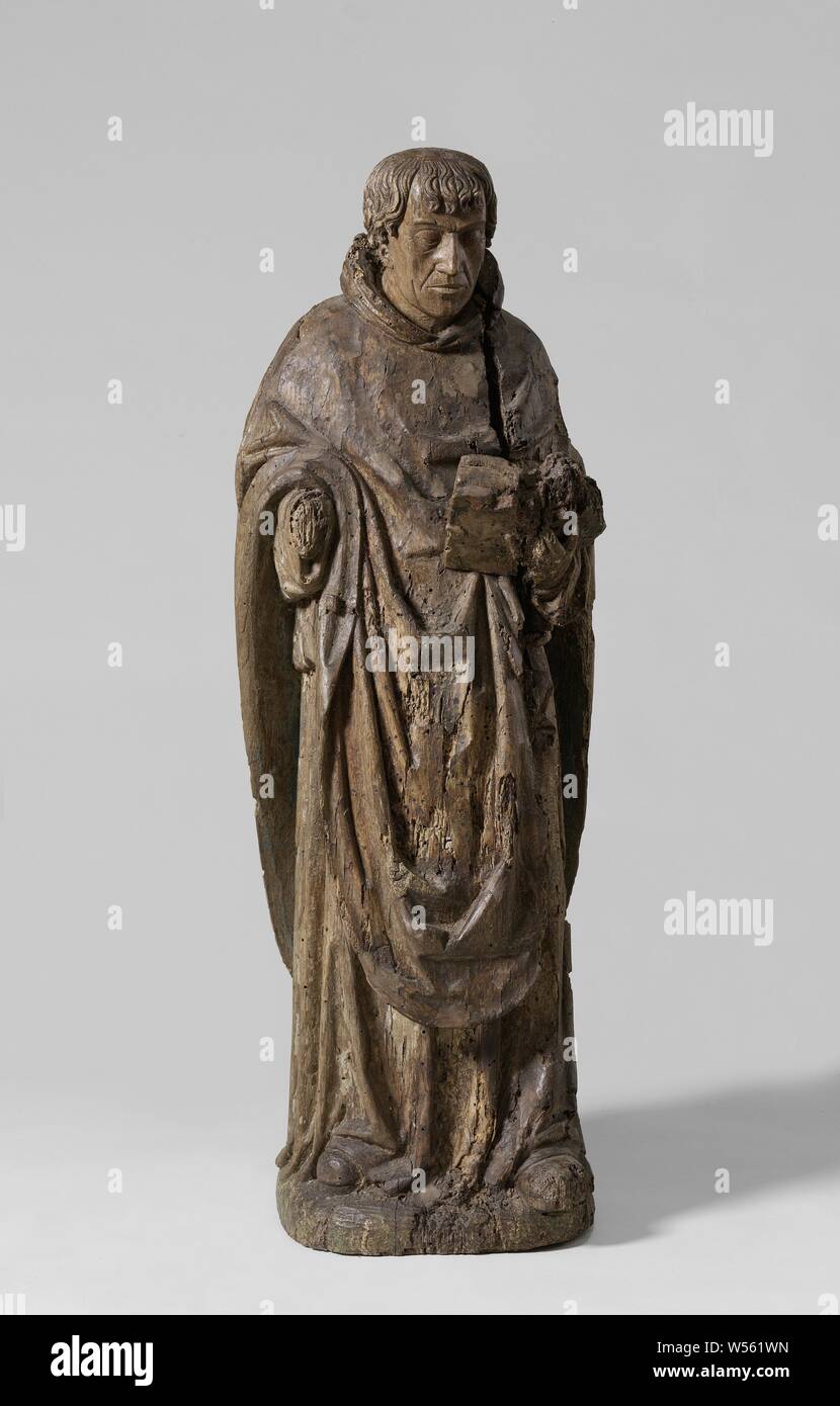 Holy Priest, He stands on a piece of land with the left leg slightly ...