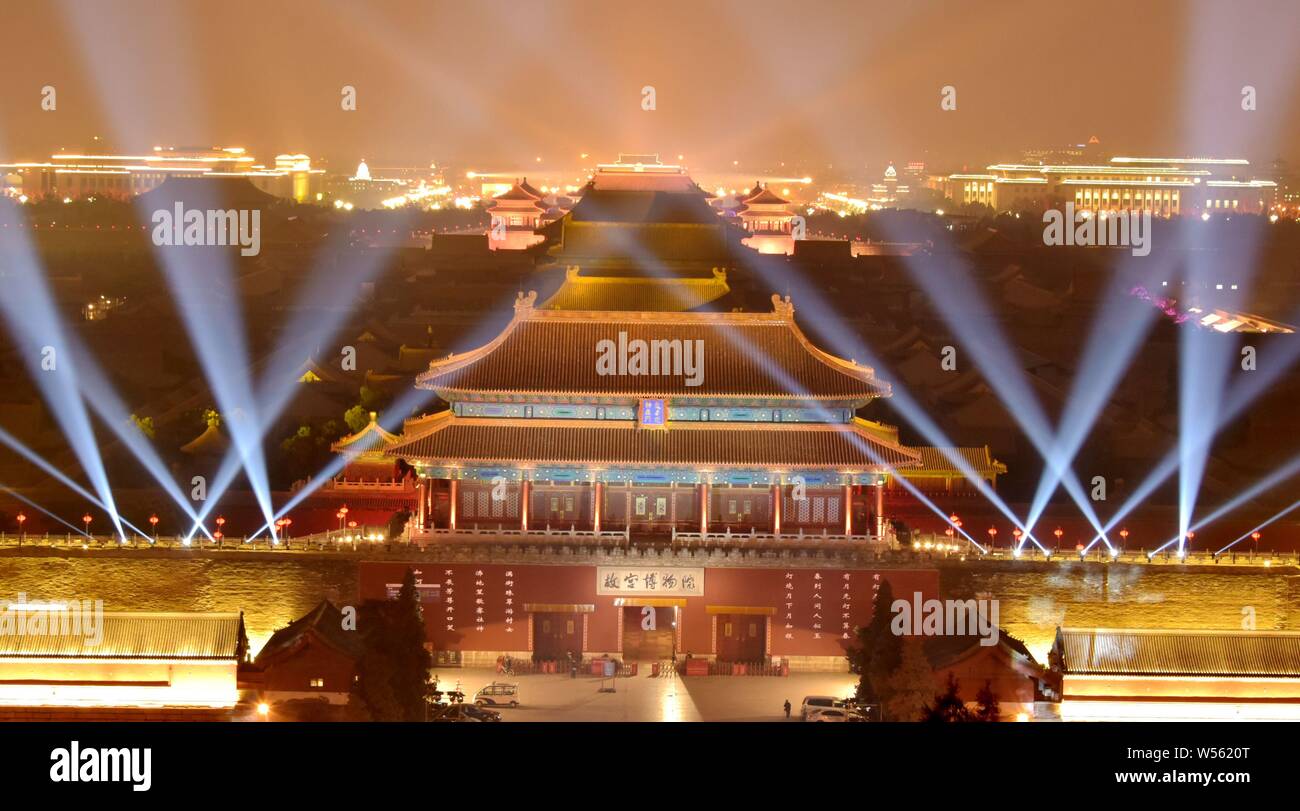 The Palace Museum, also known as the Forbidden City, is illuminated by ...