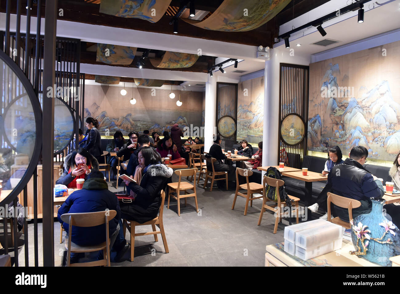 Chinese customers enjoy coffee at the Corner Tower Cafe near the Palace ...