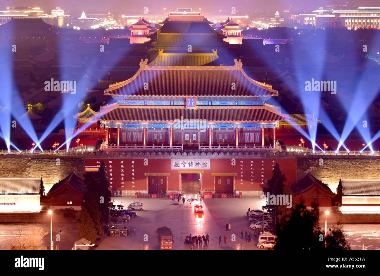 The Palace Museum, also known as the Forbidden City, is illuminated by colorful lights during a ...
