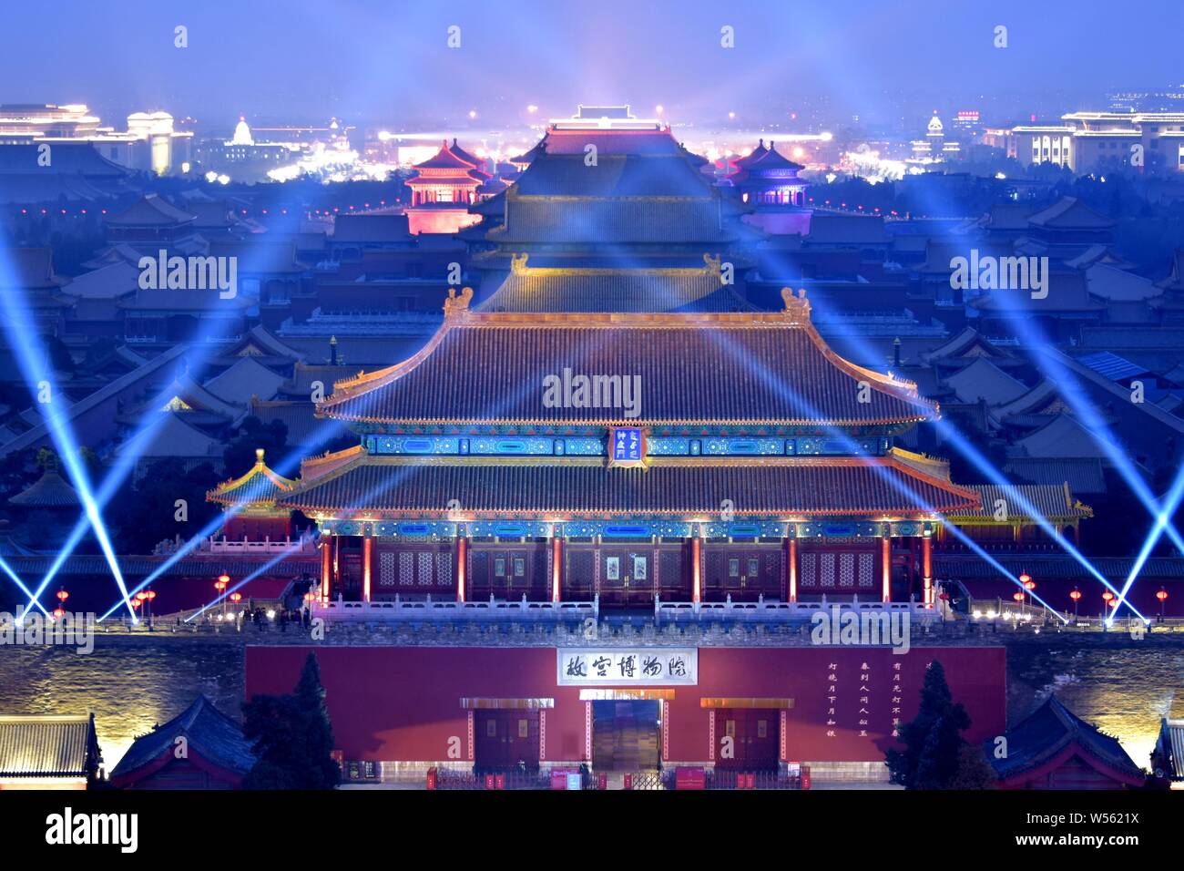 The Palace Museum, also known as the Forbidden City, is illuminated by ...