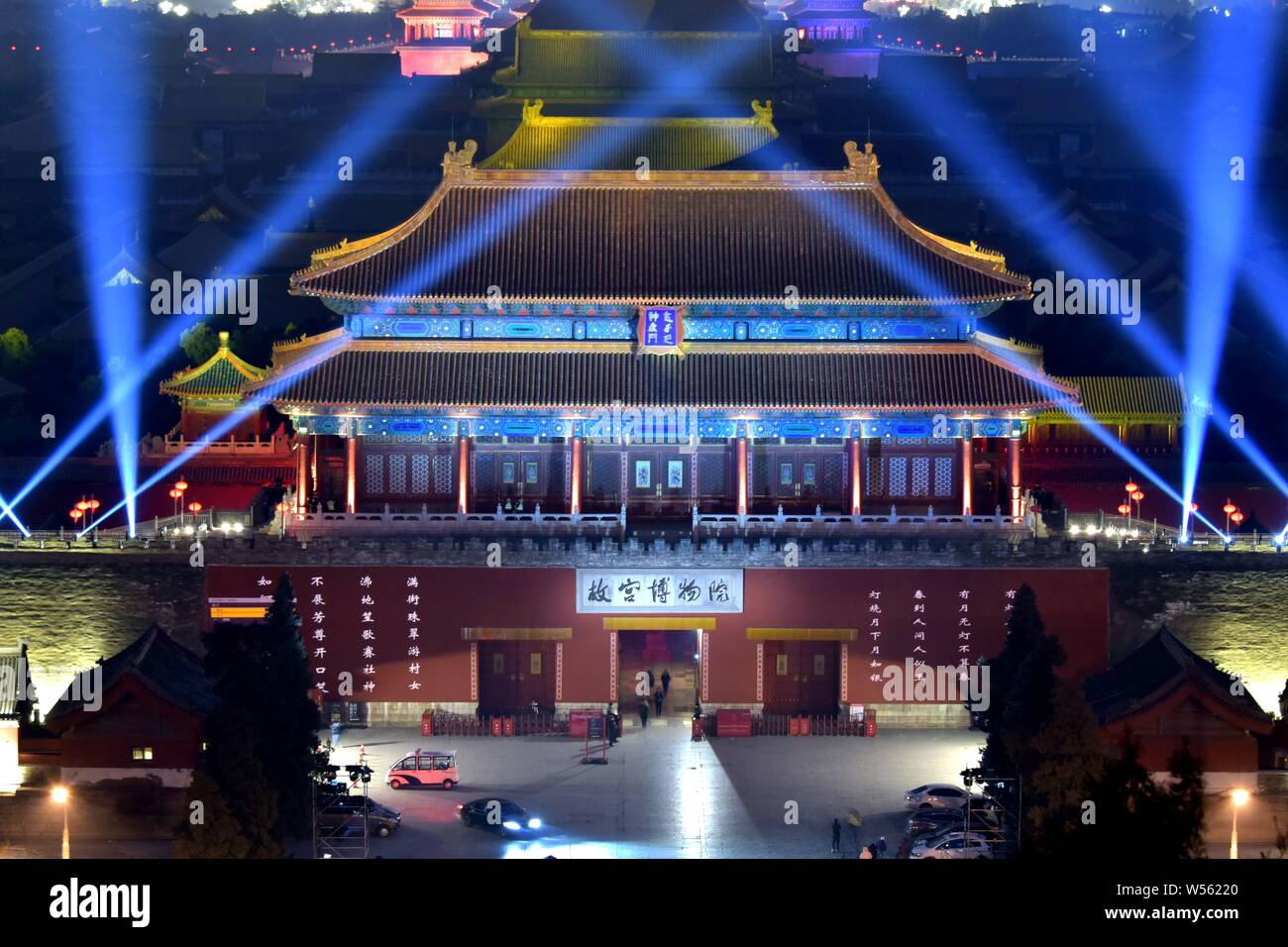 The Palace Museum, also known as the Forbidden City, is illuminated by colorful lights during a ...