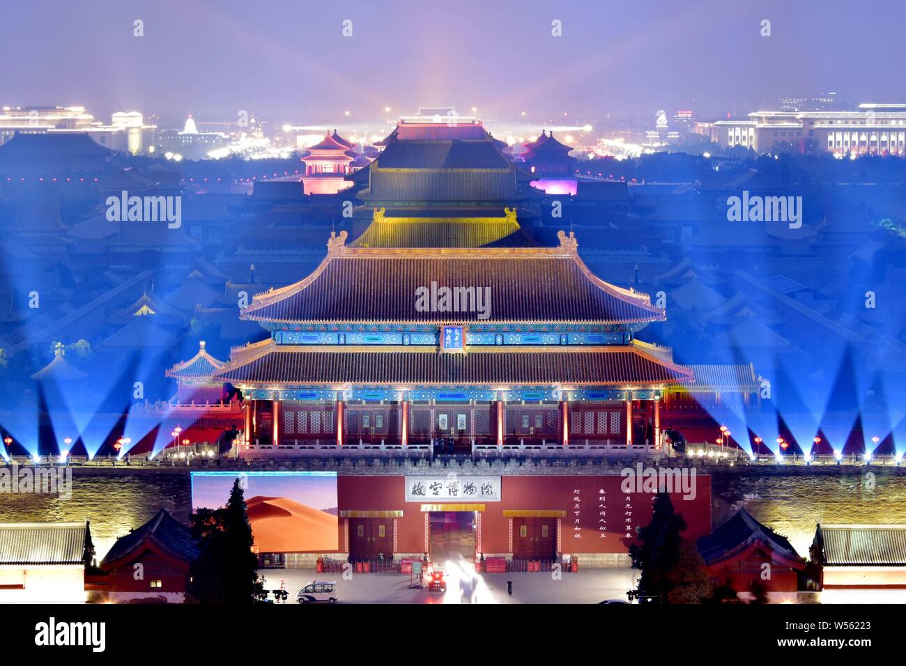 The Palace Museum, also known as the Forbidden City, is illuminated by colorful lights during a ...