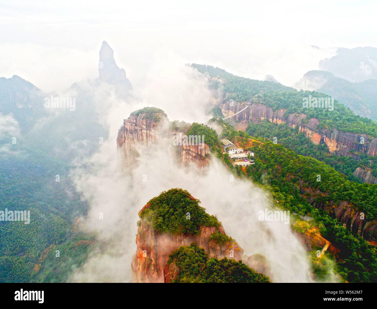 A view of seas of clouds floating through the Xianju National Park ...