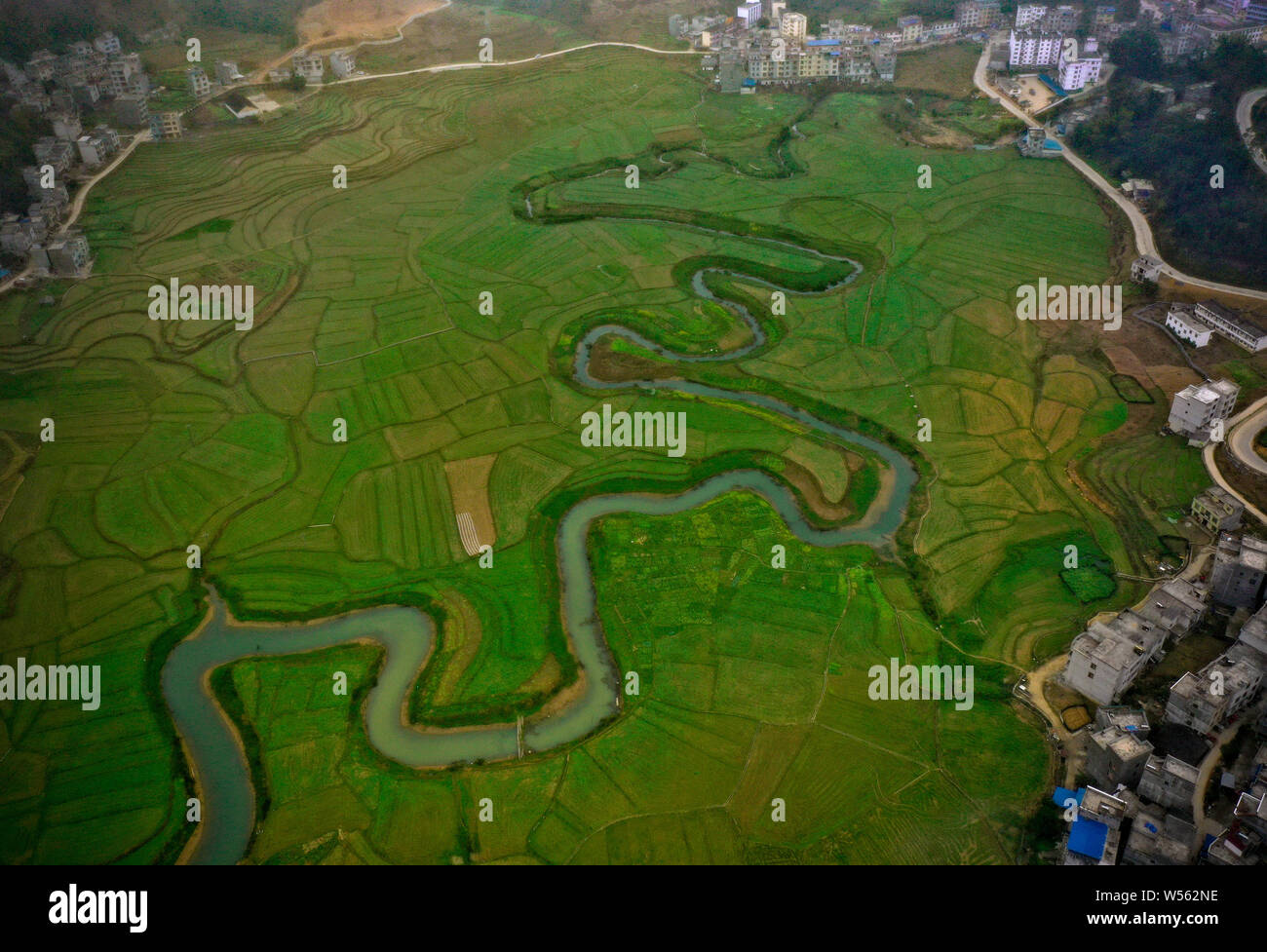 Aerial view of the Ming River, a symbol of Bama, flowing through the ...