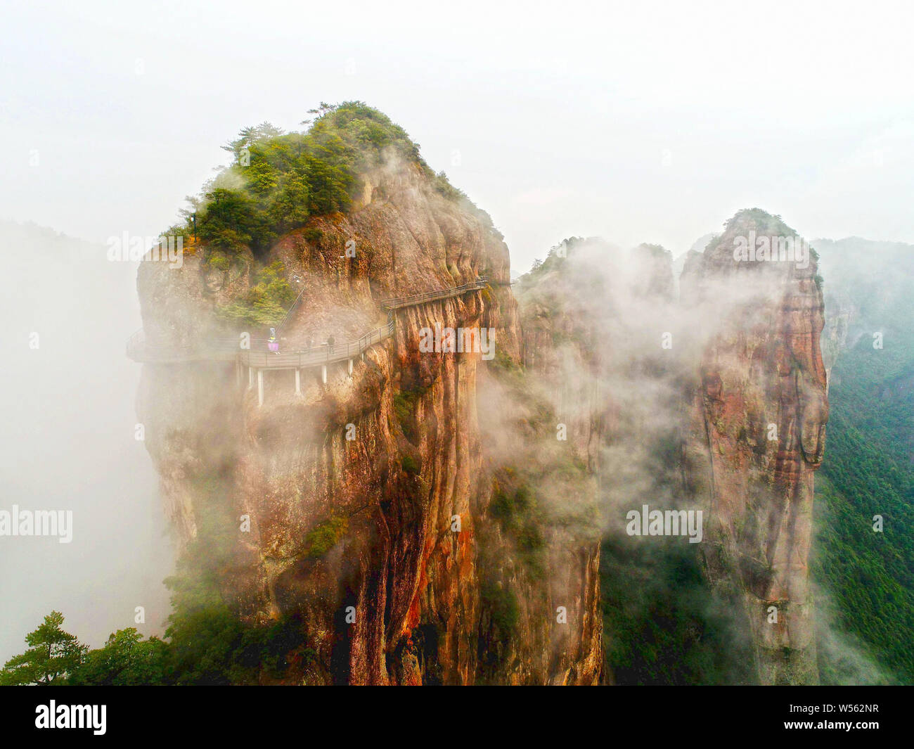 A view of seas of clouds floating through the Xianju National Park ...