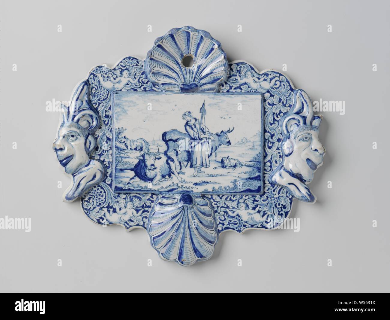 Plate, rectangular, with two shells and two jester heads embossed ...