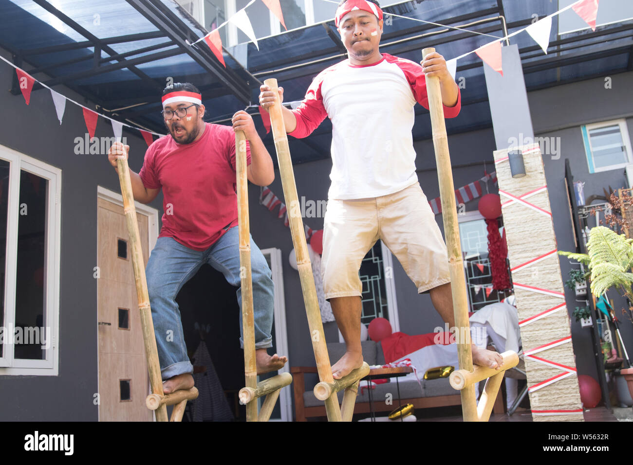 indonesian stilts race competition Stock Photo - Alamy
