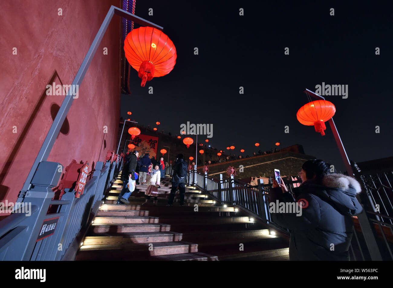 The Palace Museum, also known as the Forbidden City, is illuminated by ...