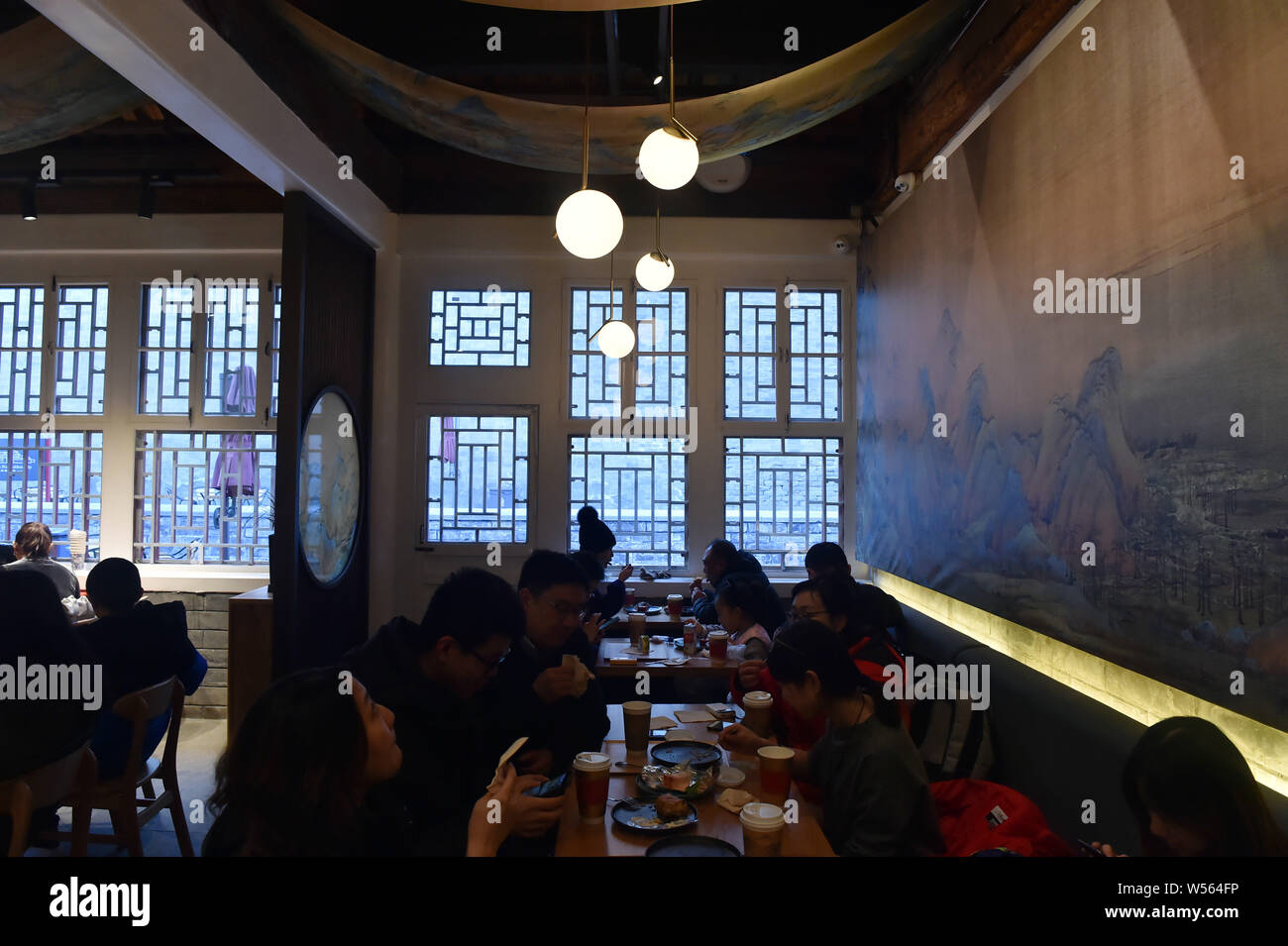 Chinese customers enjoy coffee at the Corner Tower Cafe near the Palace ...