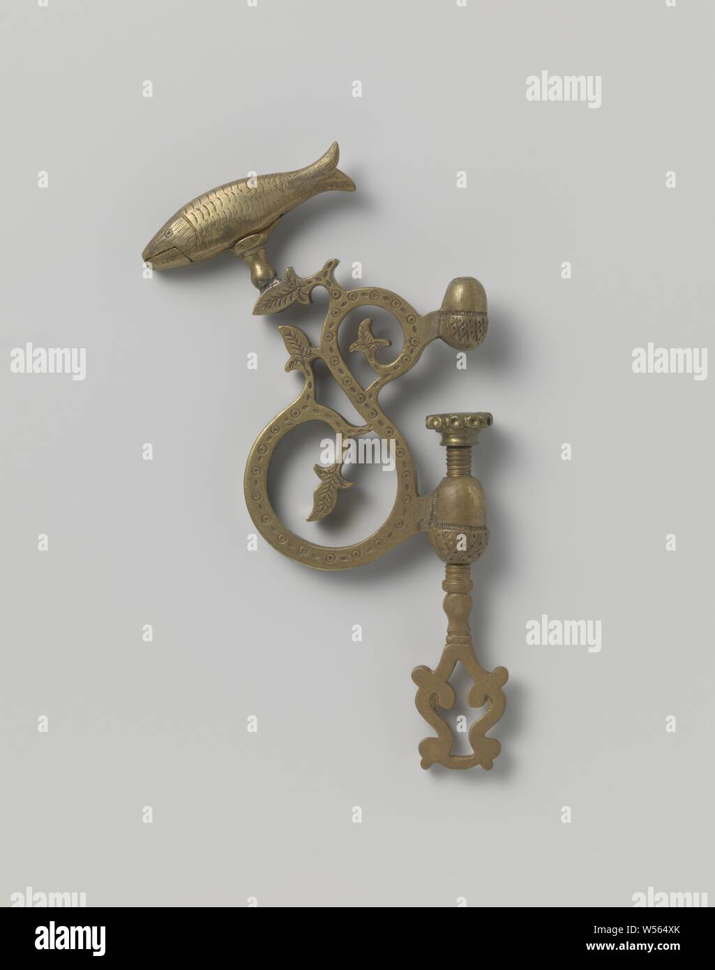 Sewing screw, decorated with an acorn and a fish. The object is cast ...