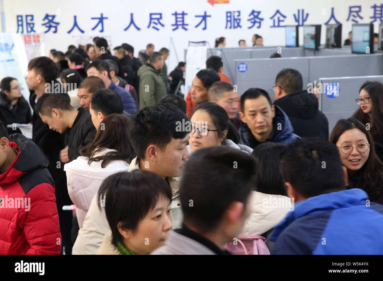 Chinese job seekers look for employment at a job fair in Nantong city ...