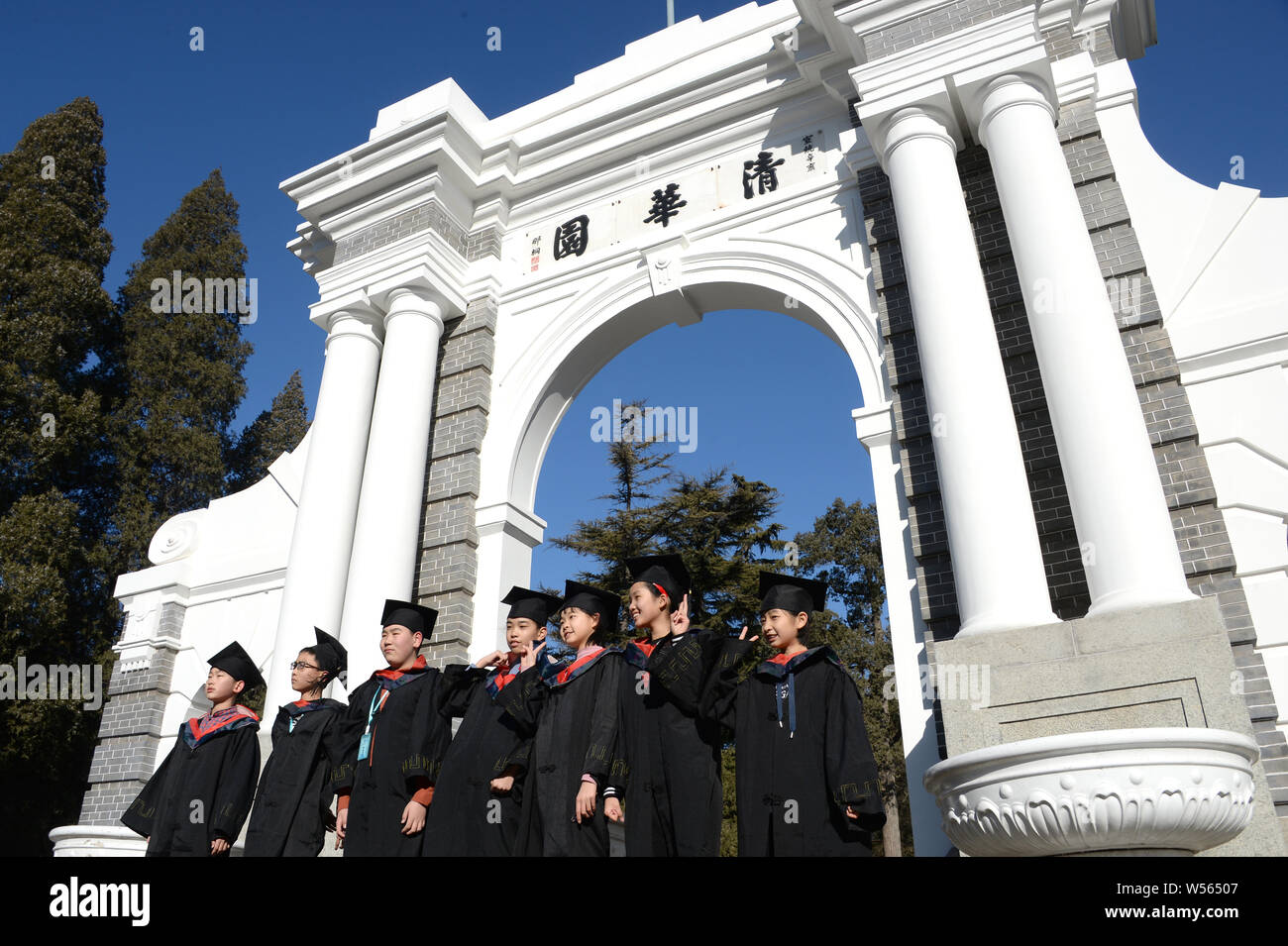 --FILE--Chinese students pose in front of the symbolic Second Gate of ...
