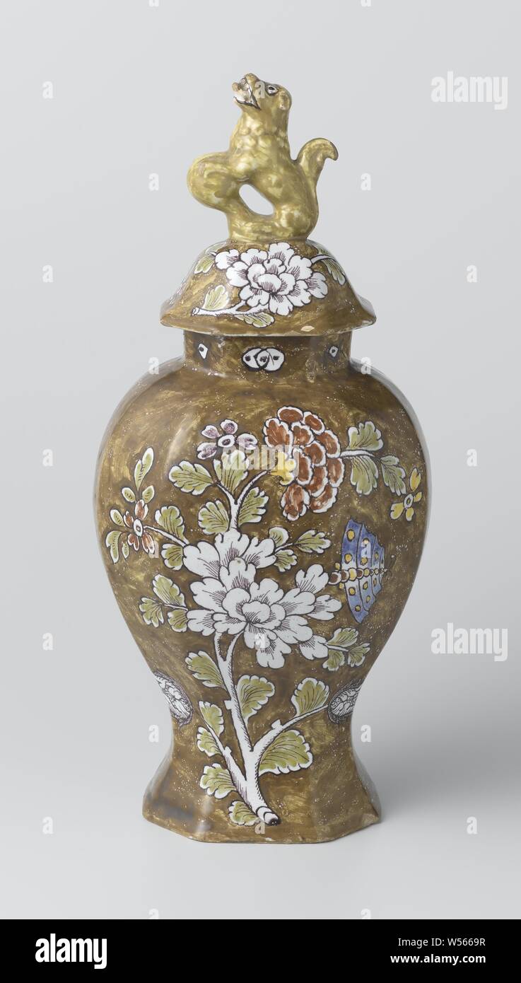 Covered pot made of faience with a multi-colored painting of flowers on ...