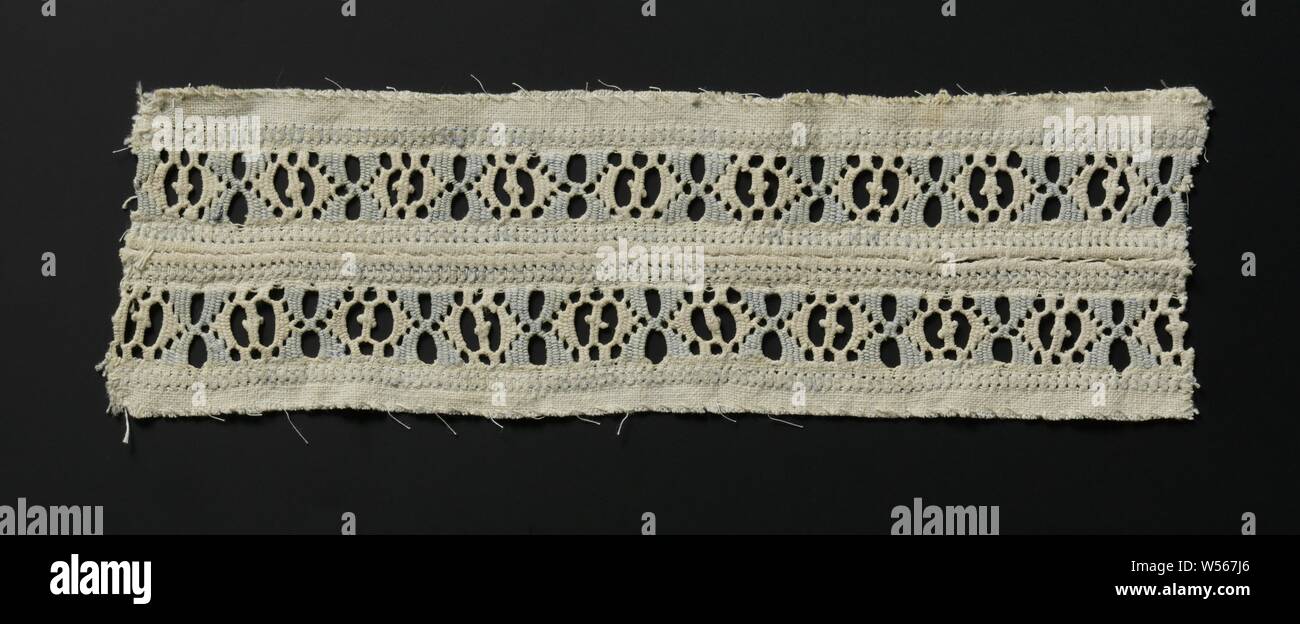 Strip of linen with blue and white lace embroidery with pulled out ...