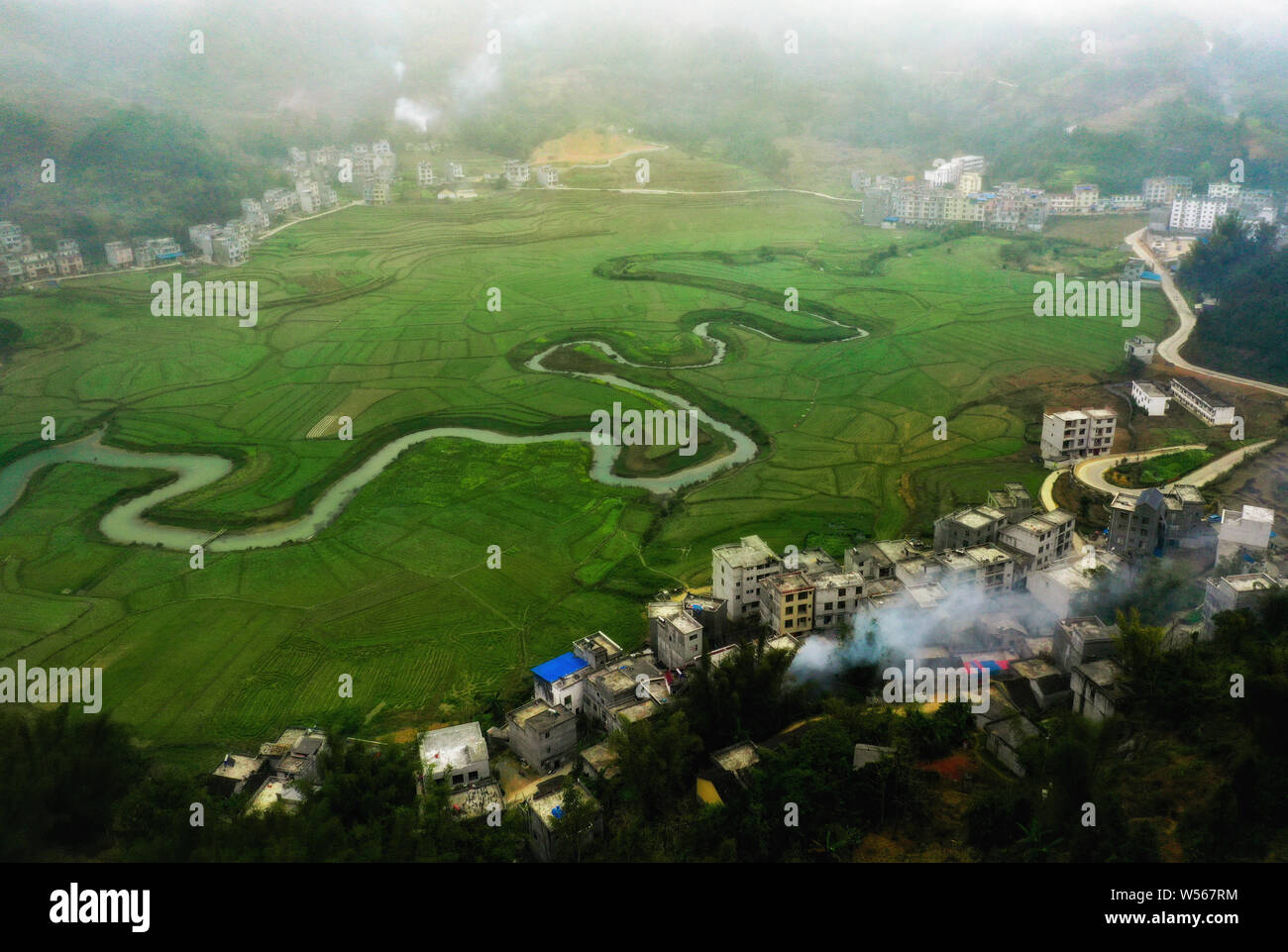 Aerial view of the Ming River, a symbol of Bama, flowing through the ...