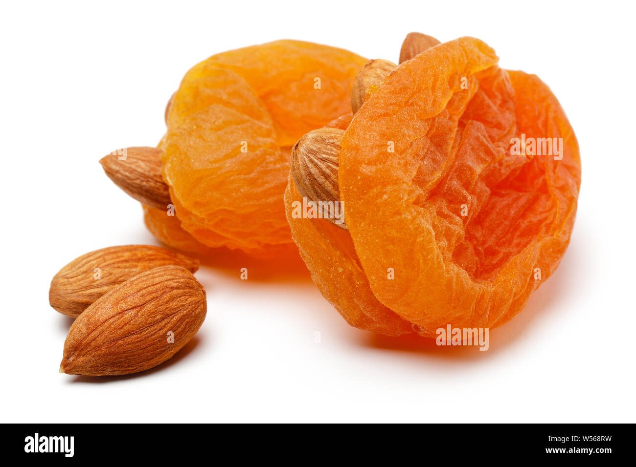 Dried apricots with almonds isolated on white background Stock Photo ...
