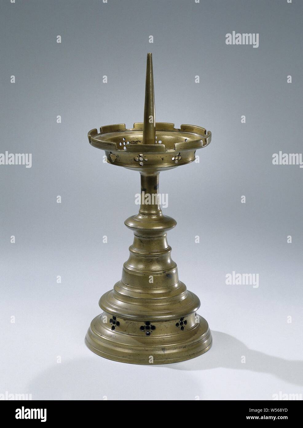 Candlestick with profiled foot and stem with a candle pin. The object ...