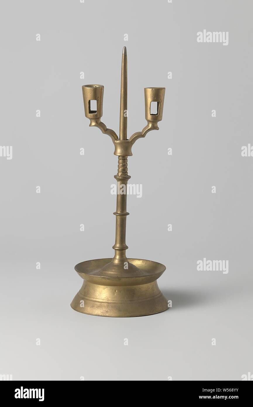 Brass candlestick, The low profiled conical foot has a raised edge at ...