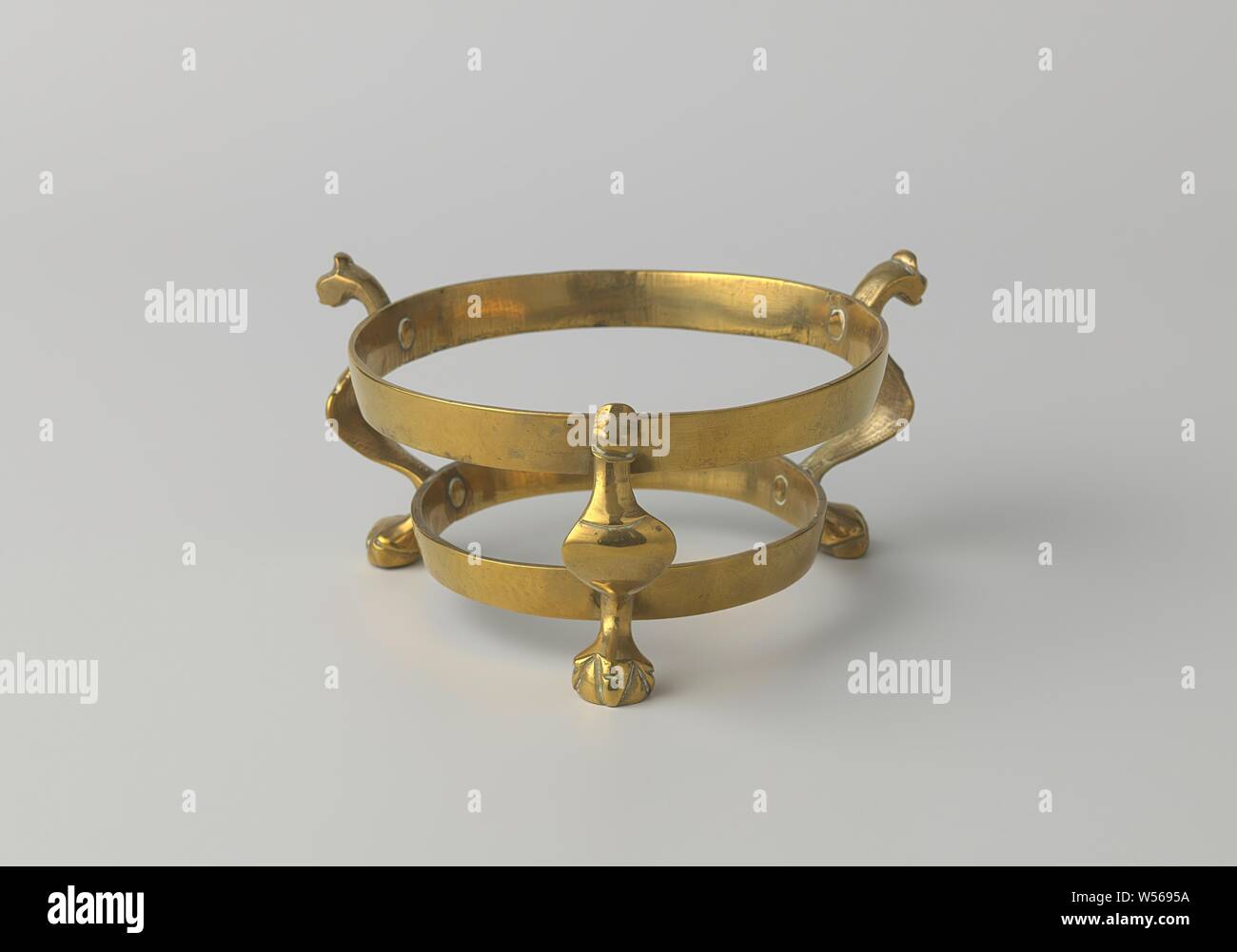 Holder of a brass brazier, Holder of a brass brazier. The object is two ...