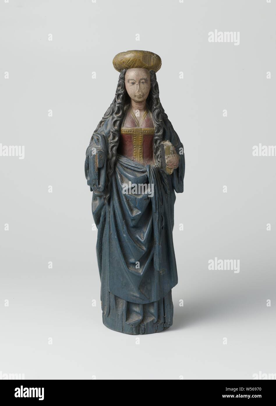 Female saint with turban, she is holding a book in the left hand. She ...