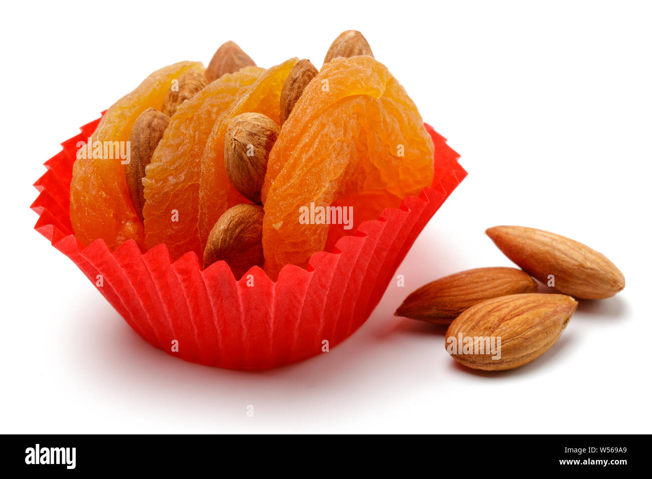 Dried apricots with almonds isolated on white background Stock Photo ...