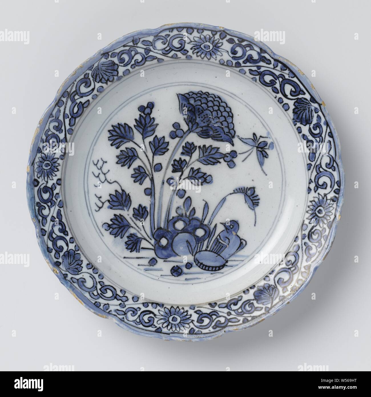 plate of faience, plate of faience with a flower decoration inspired by ...