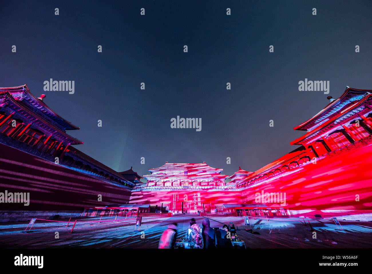 The Palace Museum, also known as the Forbidden City, is illuminated by colorful lights for a ...