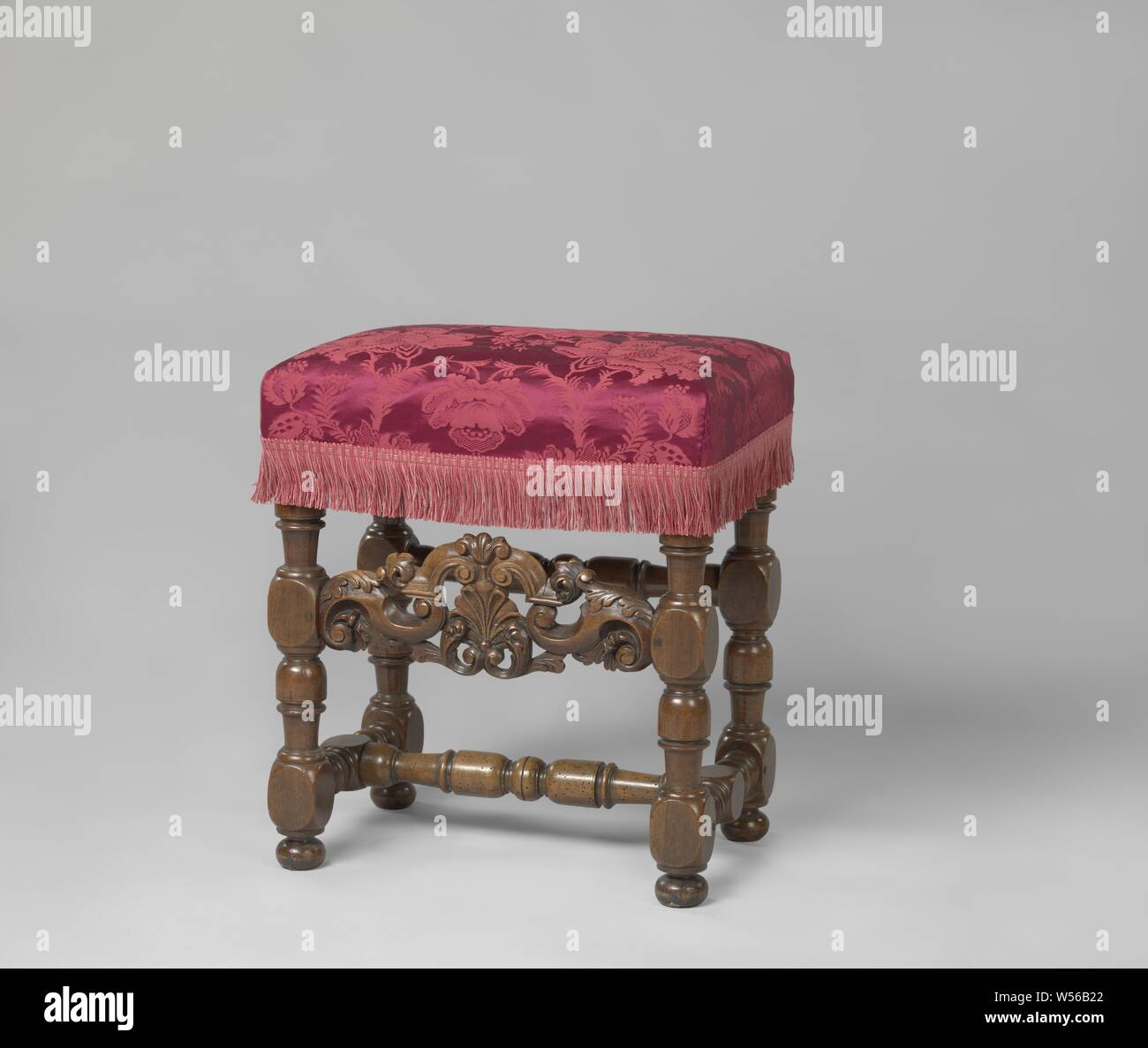 Two stools Taboeret with upholstered seat, resting on legs connected by ...