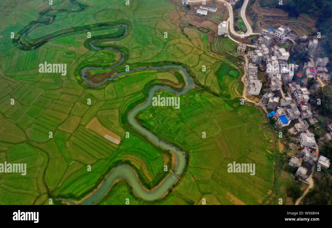 Aerial view of the Ming River, a symbol of Bama, flowing through the ...
