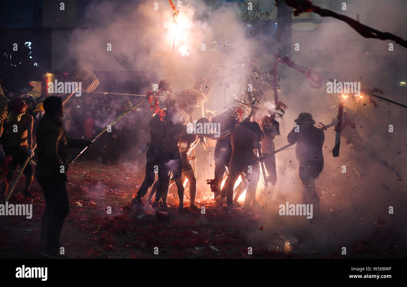 Local Chinese people conduct firecracker dragon performance to ...